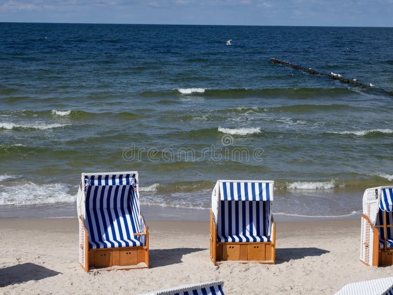 3 White-blue Beach Chairs Stand on the Shore of the Baltic Sea Stock ...