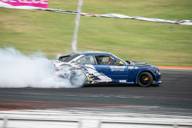 White and Blue BMW E36 Producing Smoke on a Trail for a Drift ...