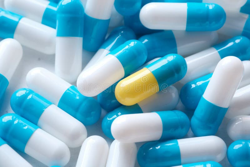 White and Blue Color Capsule Spilling Stock Photo - Image of vitamin ...