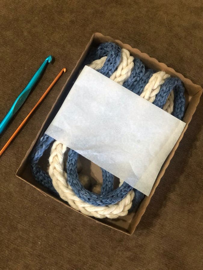White and Blue Craft Necklace Packaged with Two Crochet Hooks Next To ...