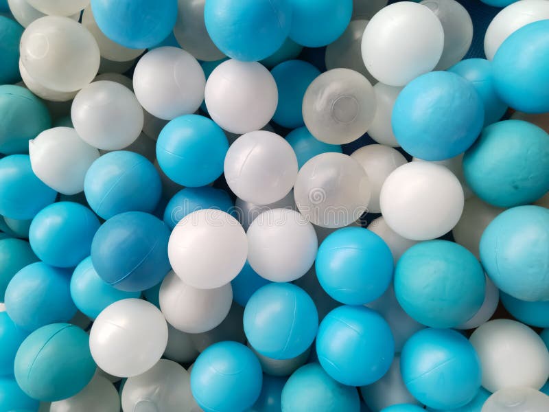 White and Blue Plastic Balls on a Playground Stock Photo - Image of ...