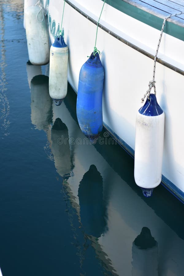 Plastic Fenders Along White Hull Stock Image - Image of buoy, pier ...