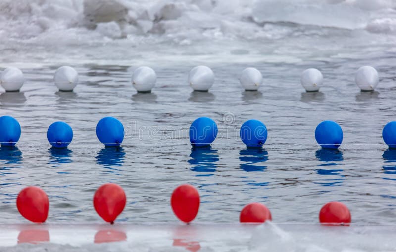 White, Blue and Red Balls Float on the Water Stock Image - Image of ...