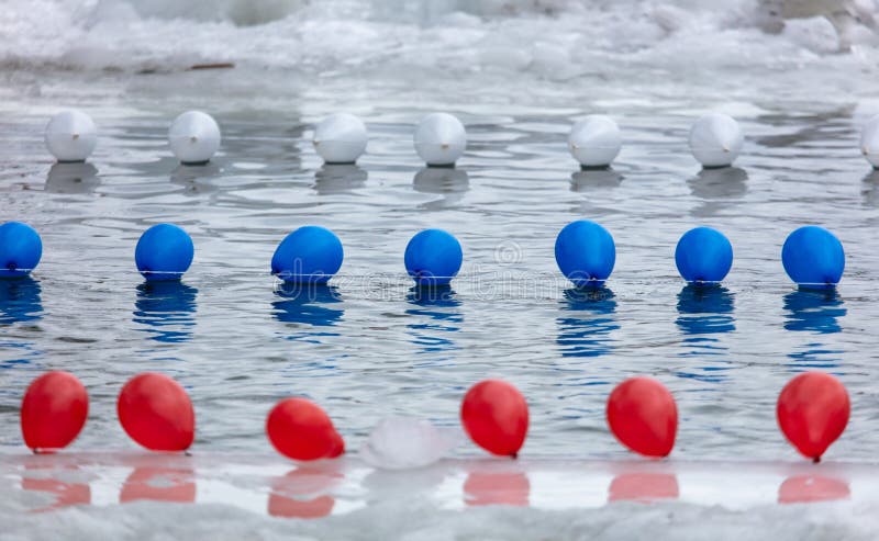 White, Blue and Red Balls Float on the Water Stock Image - Image of ...