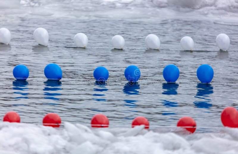 White, Blue and Red Balls Float on the Water Stock Photo - Image of ...