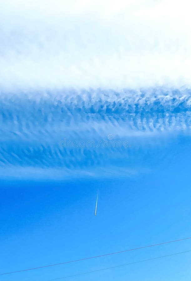 In a White Blue Sky with Clouds, a Meteor Star is Flying Down. Stock ...