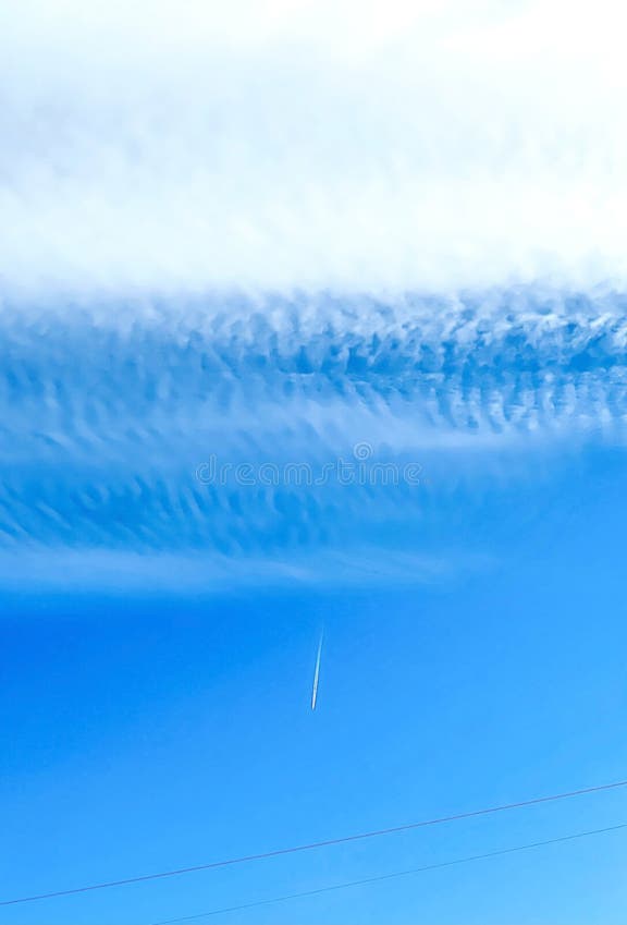 In a White Blue Sky with Clouds, a Meteor Star is Flying Down. Stock ...