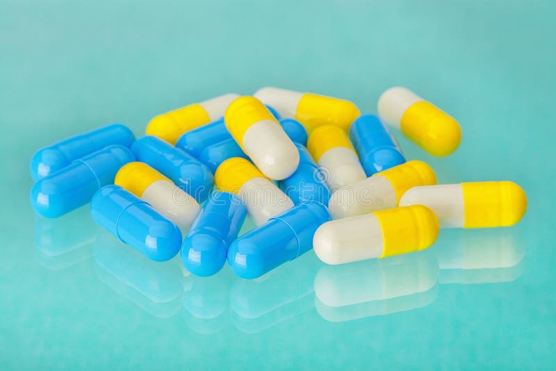 White and Blue Tablets on a Medical Table Stock Image - Image of drugs ...