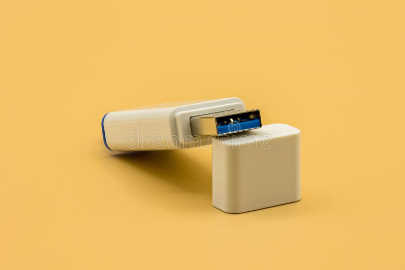 White and Blue USB Flash Drive Placed on Its Own Cap Stock Image ...