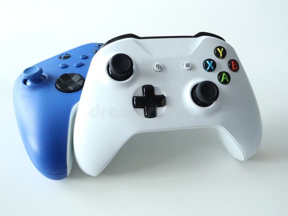 White and Blue Wireless Game Controllers Overlapping for Modern Gaming ...