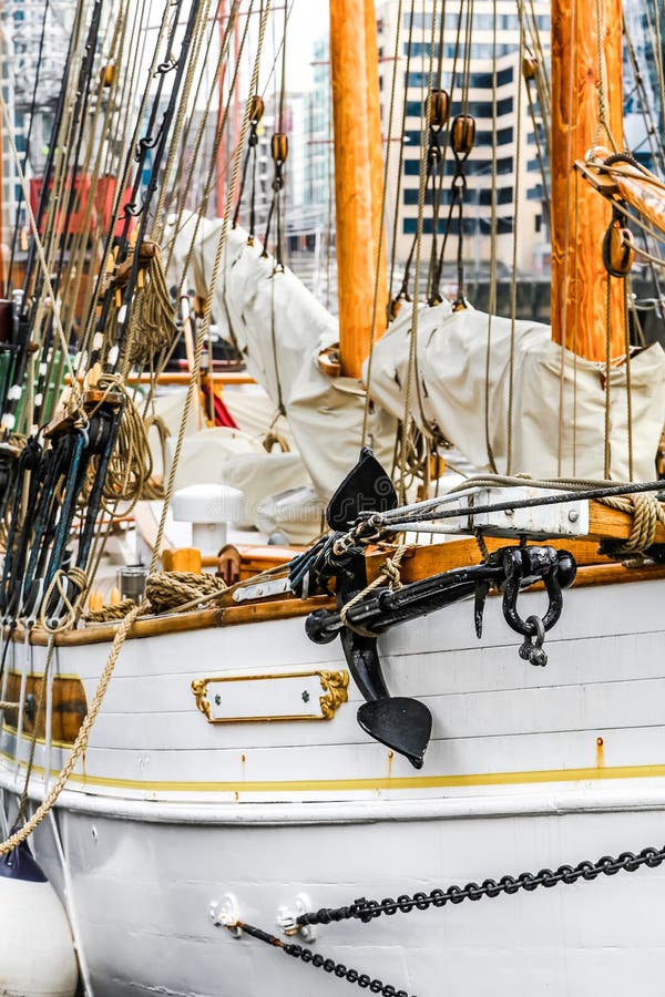 A White Boat with a Black Anchor and a White Sail Stock Image - Image ...