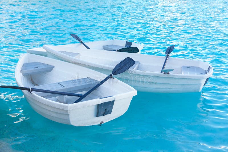 White boats at blue water stock image. Image of relaxation - 261043357