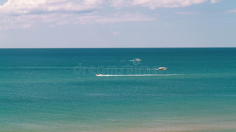 White Boats and Boats Float on the Waves of the Sea or Ocean in Summer ...