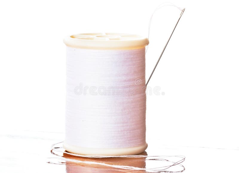 White bobbin with needle stock image. Image of craft - 23896493