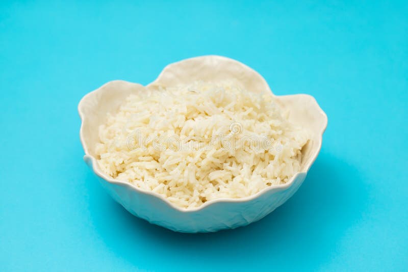 White Boiled Rice in Beautiful Bowl on Blue Stock Photo - Image of ...