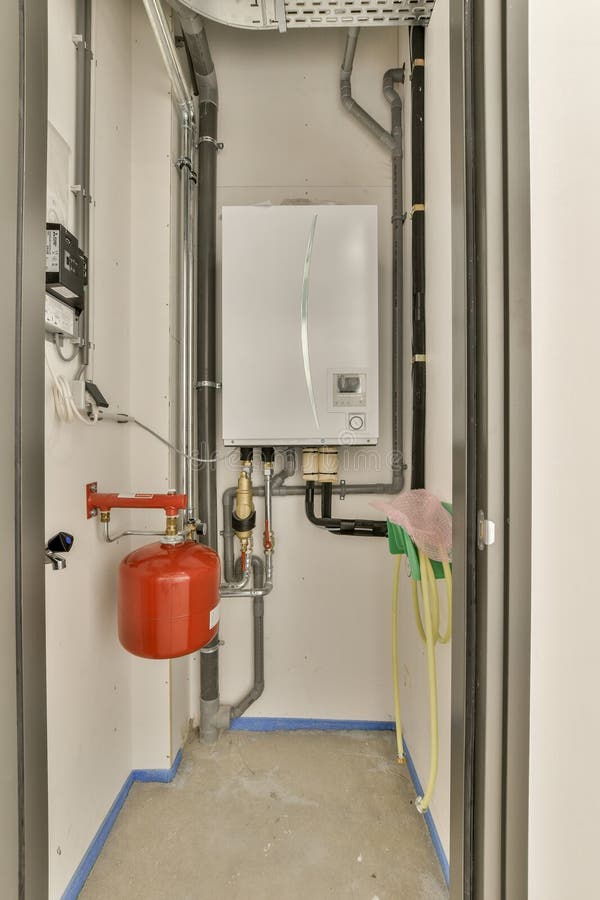 A White Boiler with an Orange Fire Hydrant in Stock Image - Image of ...