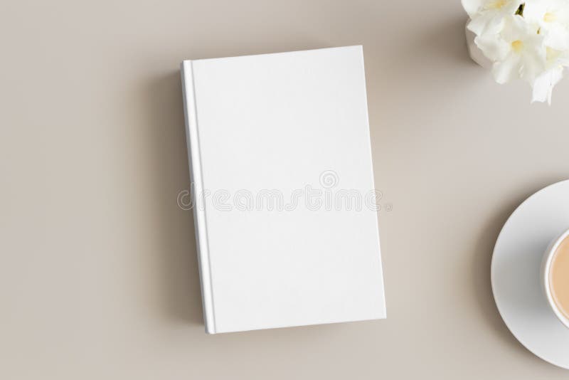 White Book Mockup with a Cup of Coffee and Oleander on a Beige Table ...