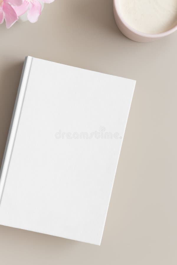 White Book Mockup with a Cup of Coffee and Oleander on a Beige Table ...