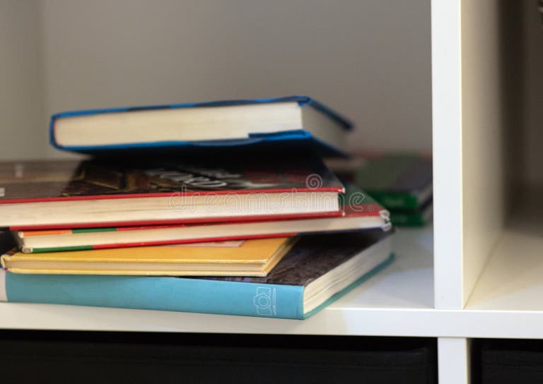 The White Bookshelf and Several Books Lying in Disarray Stock Photo ...