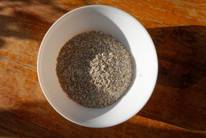 A white bowl of bran stock photo. Image of brown, food - 169973336