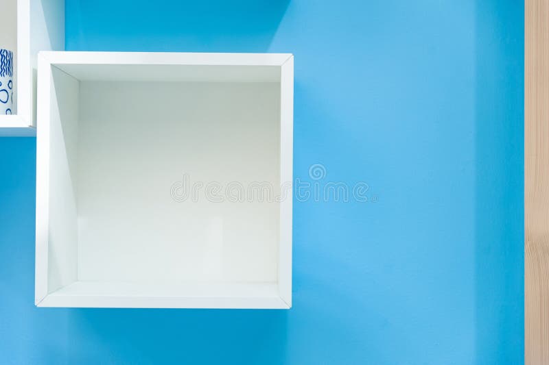 White Box Shelf Isolated on Blue Background. Stock Photo - Image of ...