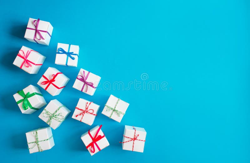 White Boxes with Bright Ribbons on a Blue Background Stock Illustration ...