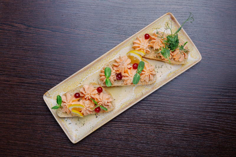 White Bread Sandwiches with Fish Cream and Herbs on a White Plate ...