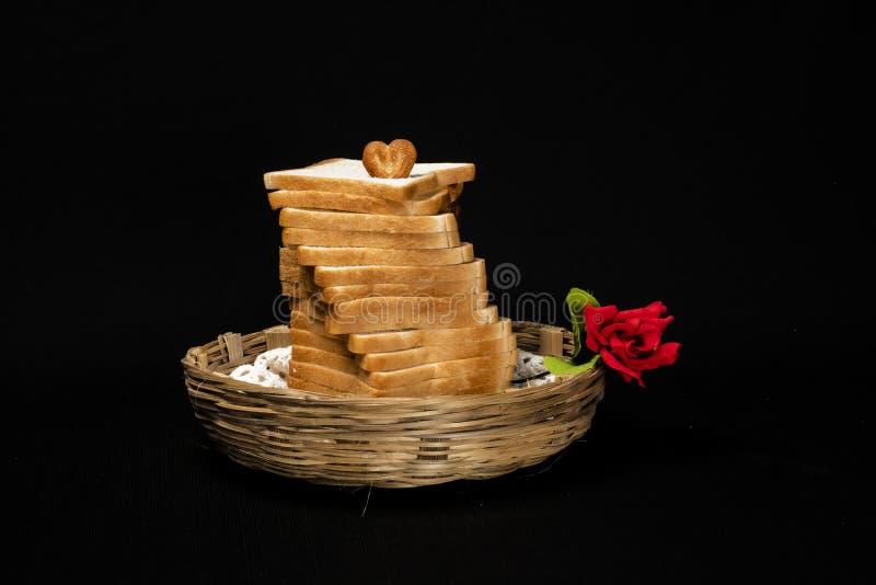 White Bread Stack in Stick Bowl, on Top Heart Shaped Biscuit with Red ...