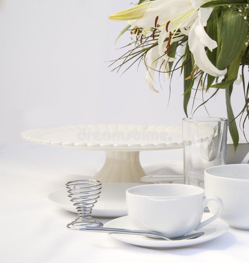 White Breakfast Table Setting with Lily Flowers Stock Photo - Image of ...