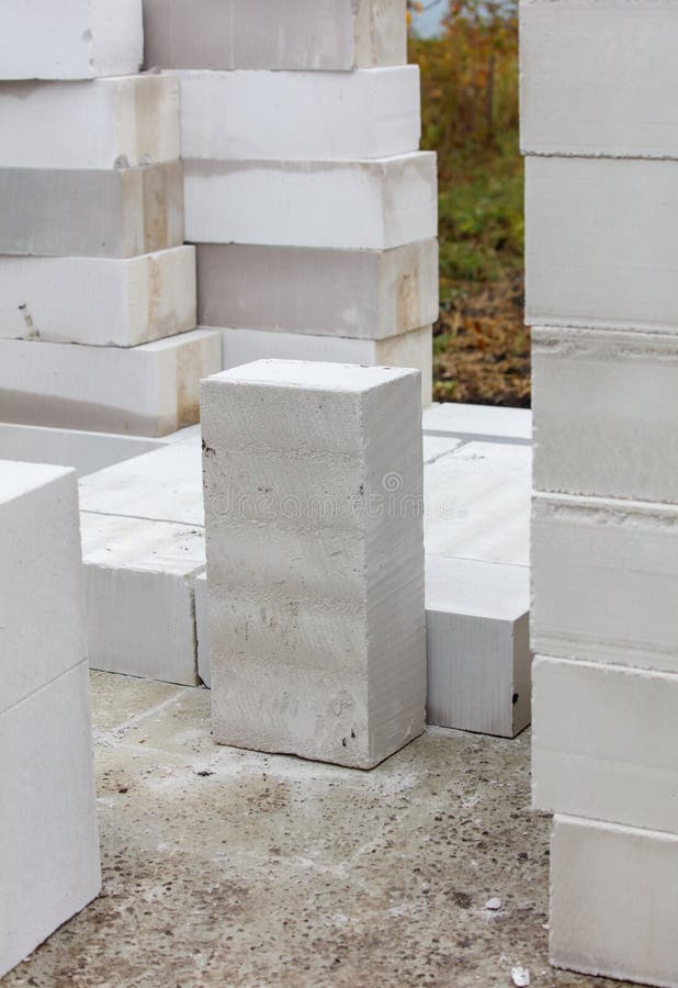 A White Brick is Sitting on a Cement Slab Stock Photo - Image of ...