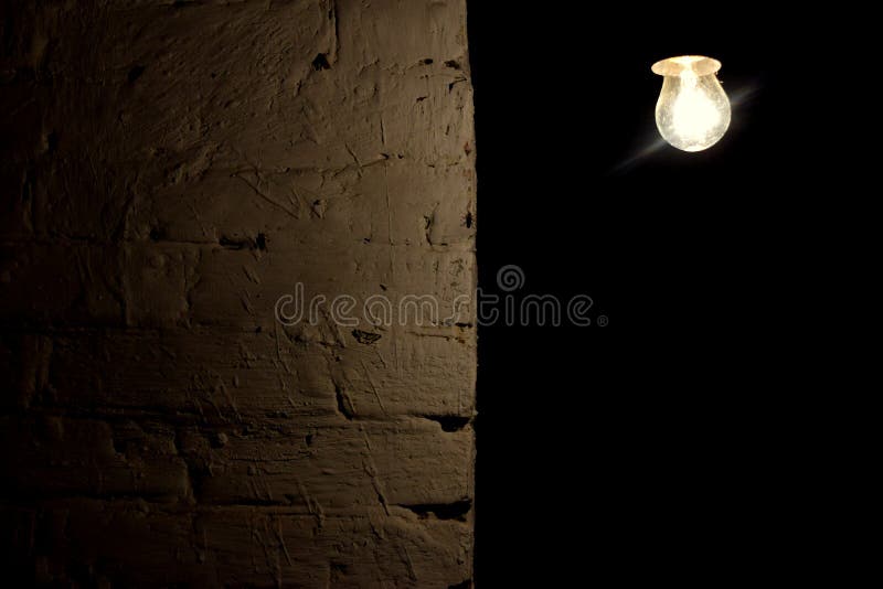 Brick Wall Lit by a Light Bulb Stock Image - Image of shadow, black ...