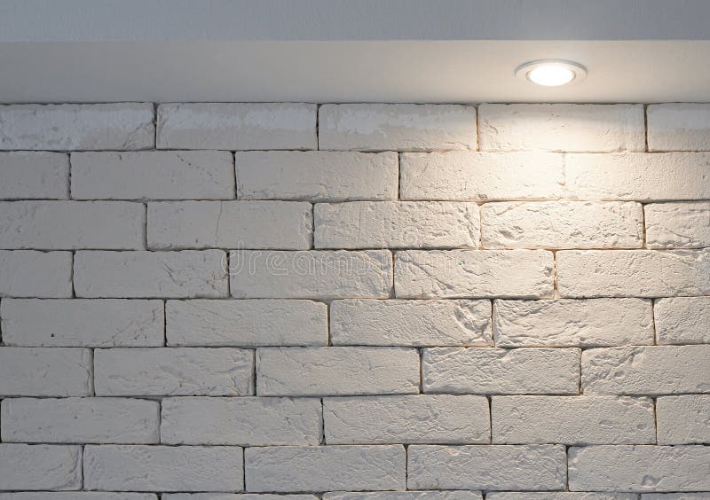 White Brick Wall Lit by a Lamp Stock Photo - Image of background ...