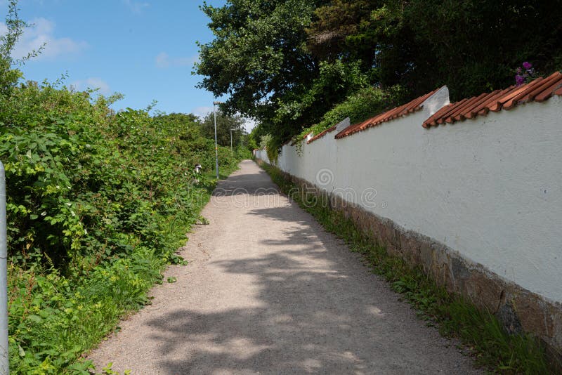 White Brick Wall by a Narrow Uphill Path.. Stock Image - Image of ...