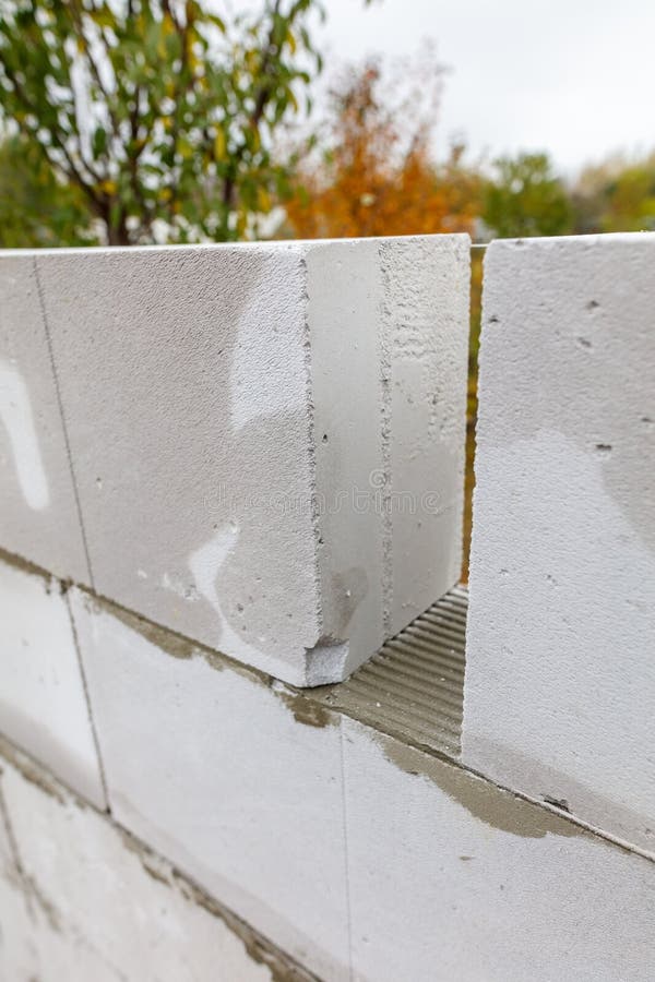 A White Brick Wall with a Small Hole in it Stock Photo - Image of ...