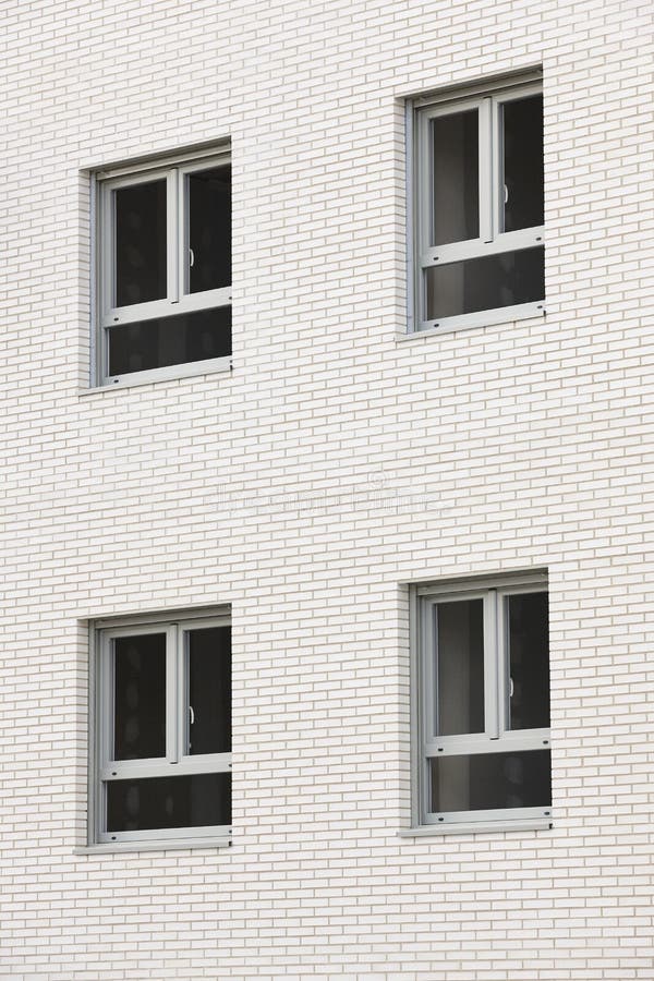 White Bricks Building Facade with Windows Under Construction. Vertical ...