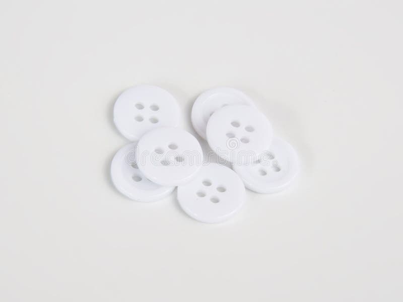 White Bright Cloth Buttons on the White Background Stock Image - Image ...