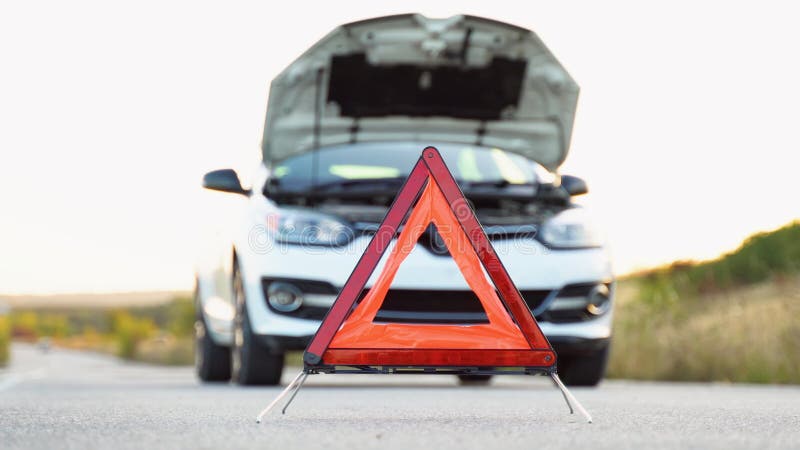 Car with Problems and a Red Triangle To Warn Other Road Users Stock ...