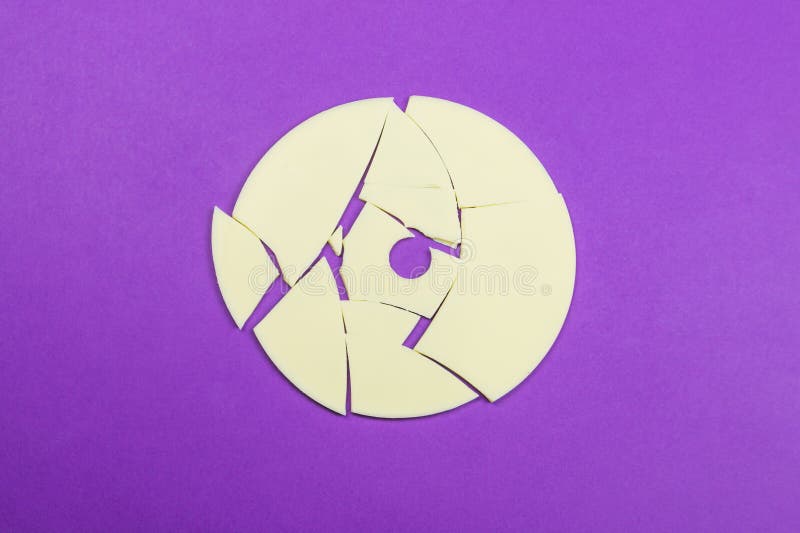 Pieces of Broken Disc on Color Background Stock Photo - Image of ...