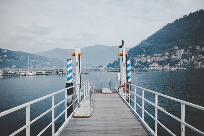 White And Brown Pathway Above Body Of Water In Front Of Cityscape ...