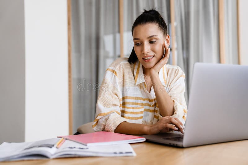 White Brunette Woman Doing Homework and Using Laptop Stock Image ...