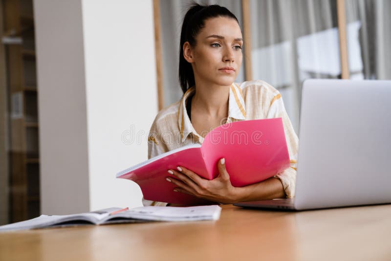 White Brunette Woman Doing Homework and Using Laptop Stock Photo ...