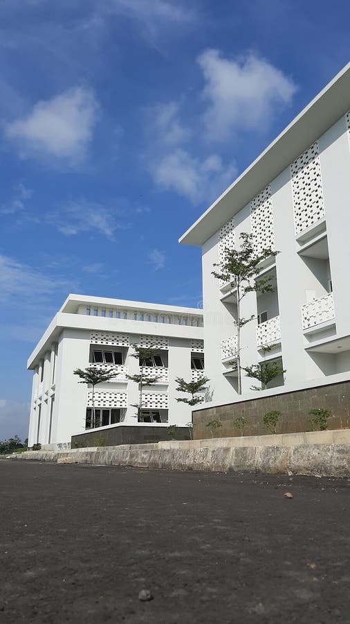 White Building for College with Blue Skies Stock Image - Image of skies ...