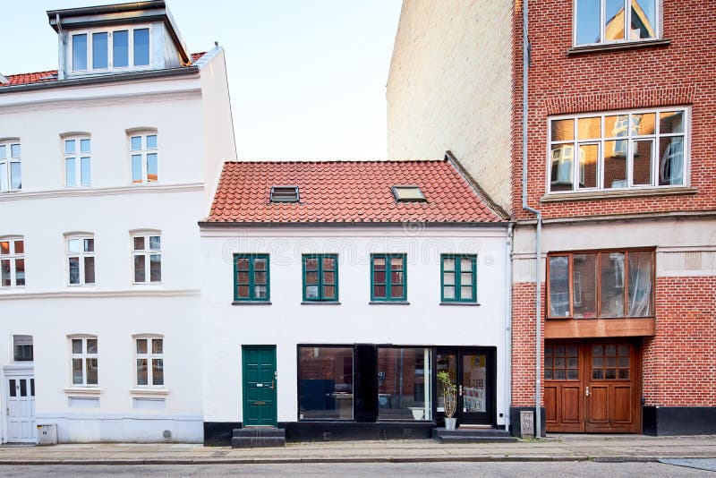 White Building with Green Door and Windows Editorial Stock Photo ...