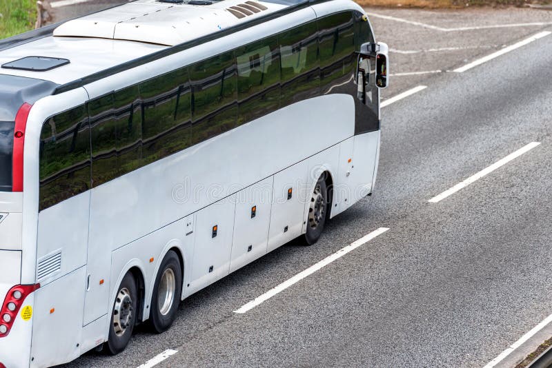 White Bus Coach on Uk Motorway in Fast Motion Stock Photo - Image of ...
