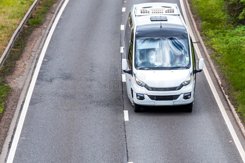 White Bus Coach on Uk Motorway in Fast Motion Stock Photo - Image of ...