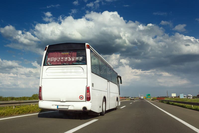 White Bus is Done Overtaking on the Highway Stock Image - Image of ...