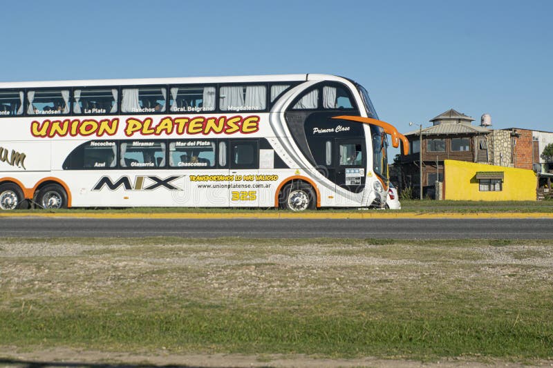 White Bus on the Road and Yellow House Travel Editorial Stock Image ...