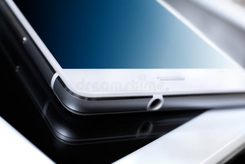 White Business Smartphone with Blue Reflection Lying on White Tablet ...