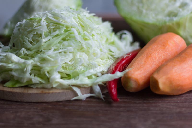 White Cabbage Cut into Strips and Carrots for Cooking Stock Photo ...