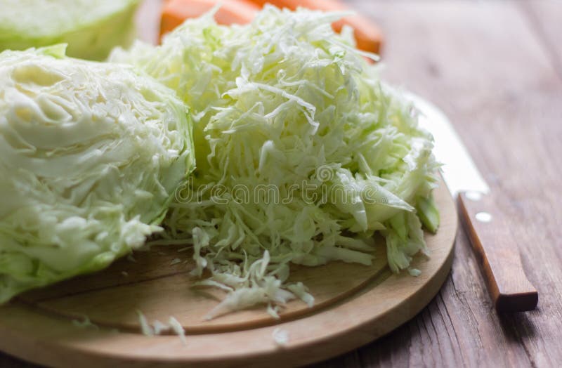 White Cabbage Cut into Strips and Carrots for Cooking Stock Image ...